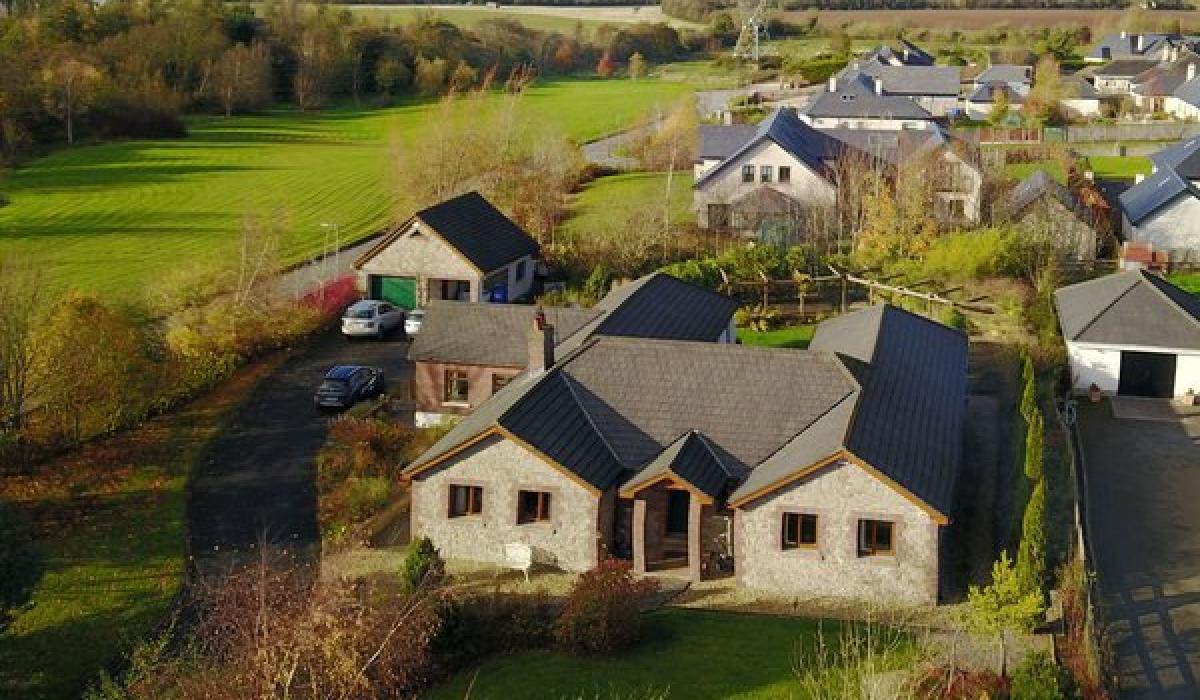 Superb home in Two Mile house with sunroom and garage could be yours ...